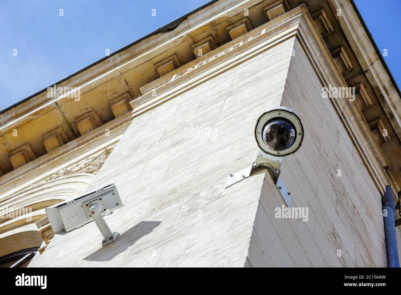 security CCTV camera or surveillance system fixed on old construction ...