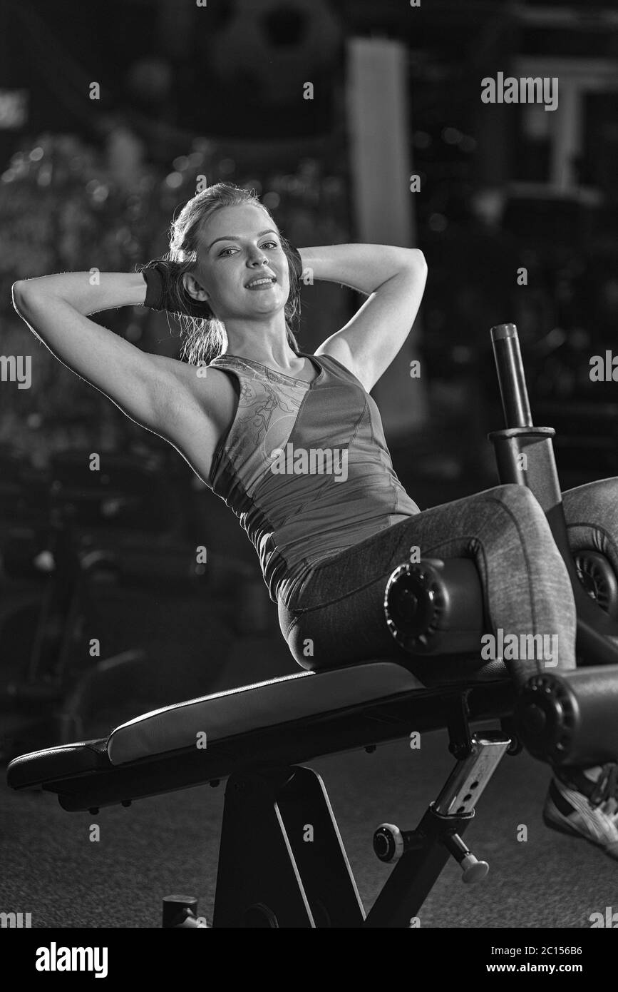 Woman doing strength exercises for abs muscles Stock Photo - Alamy