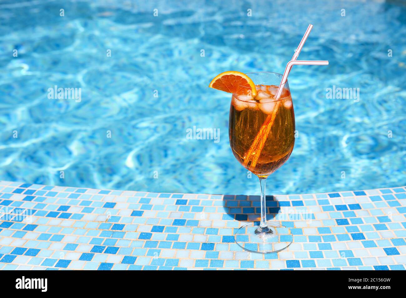 Glass of alcohol cocktail near the pool Stock Photo - Alamy