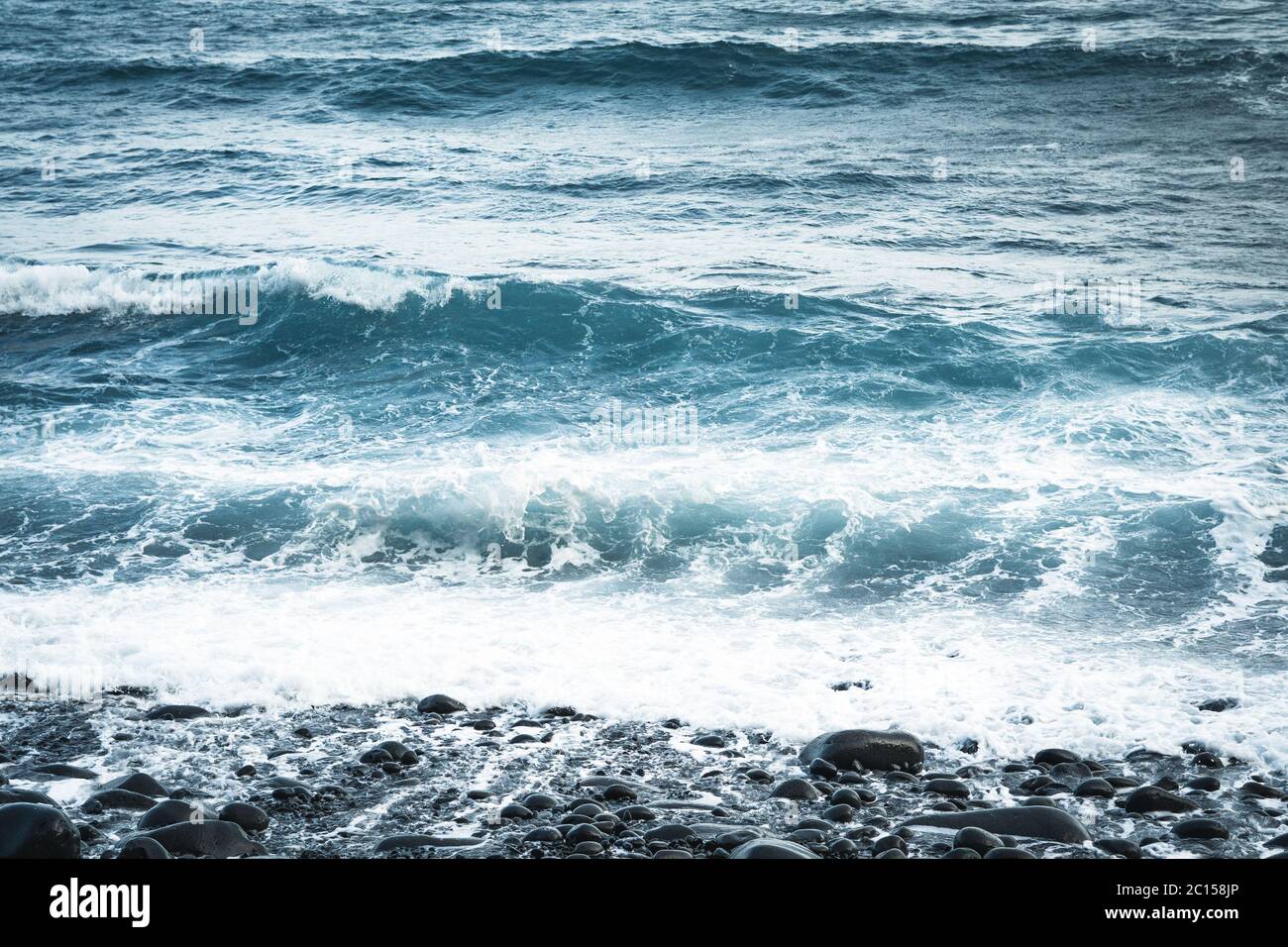 Stone is watching big waves. Super crazy waves in Portugal Stock Photo ...