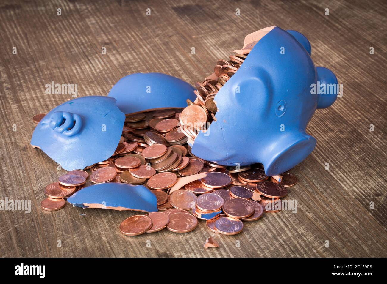 Broken piggy bank coins scattered hi-res stock photography and images ...