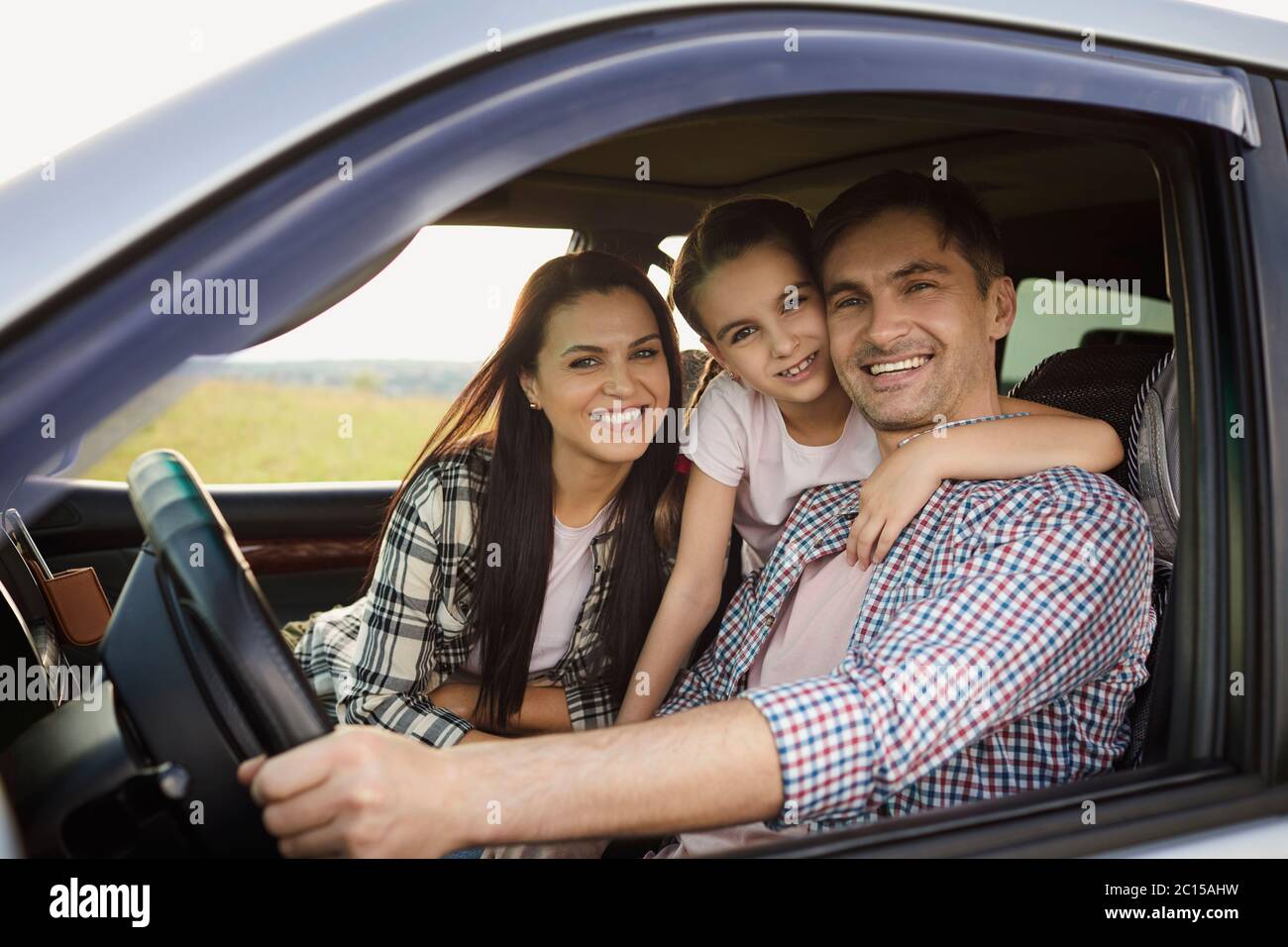 Happy family on the road in a car on an adventure vacation trip Stock ...