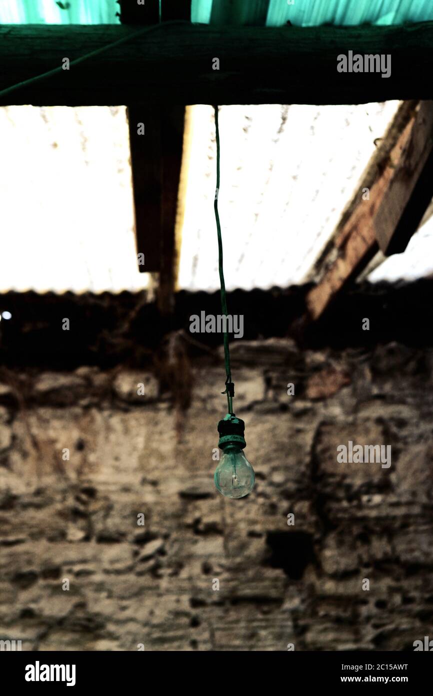 Lamp on a Cable in an Old House Room Photo Stock Photo - Alamy