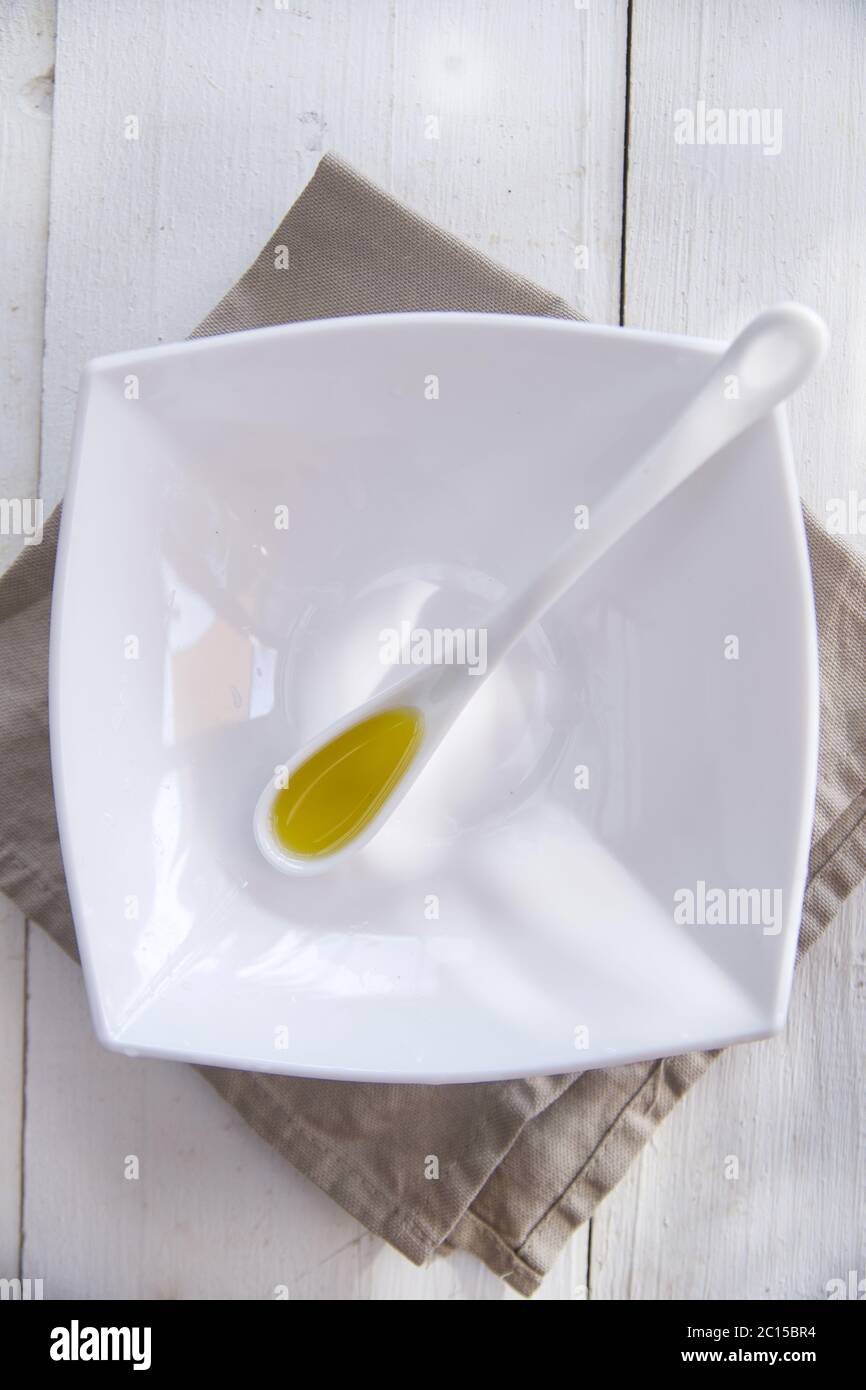 Small containers with extra virgin olive oil Stock Photo - Alamy