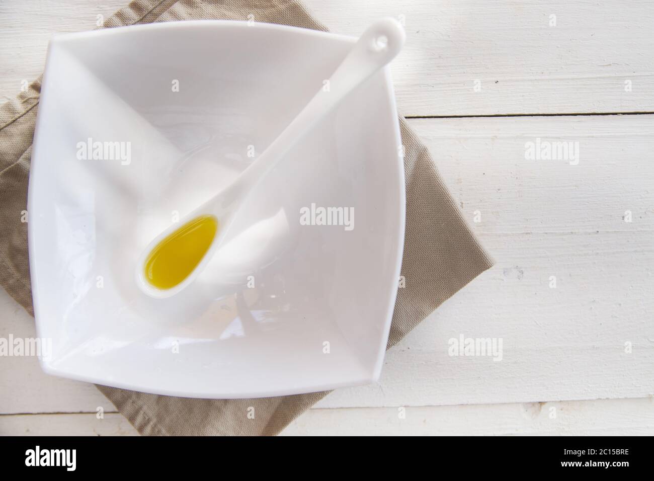 Small containers with extra virgin olive oil Stock Photo - Alamy