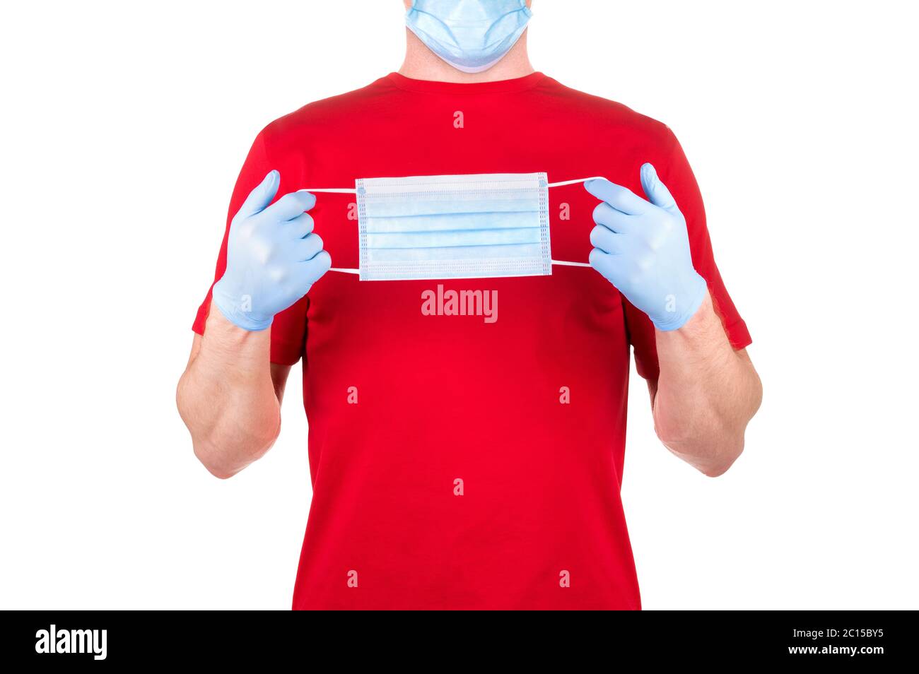 Man in red t-shirt wearing disposable face mask isolated white ...
