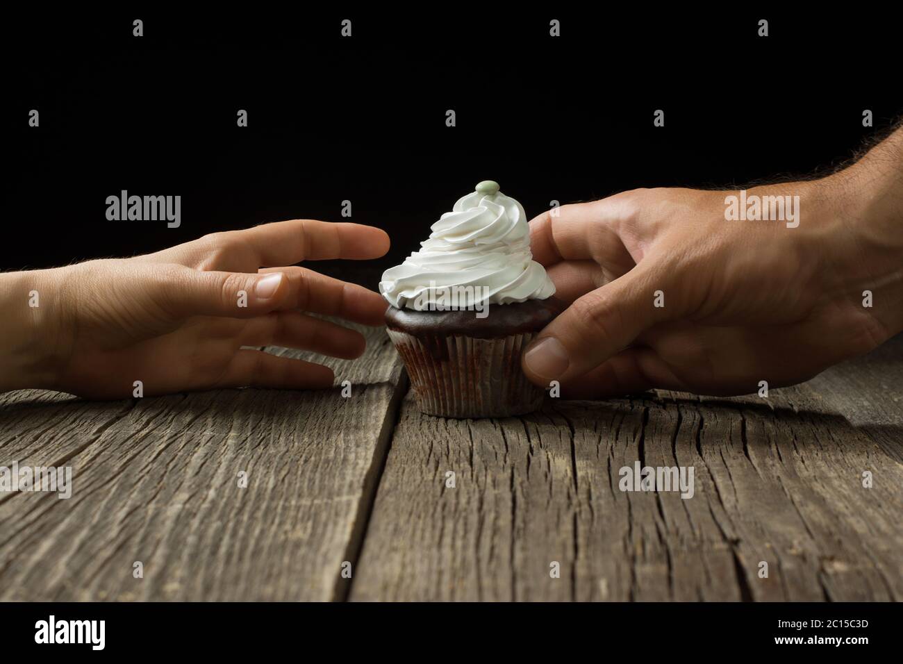 Hand reaching out for cake hi-res stock photography and images - Alamy