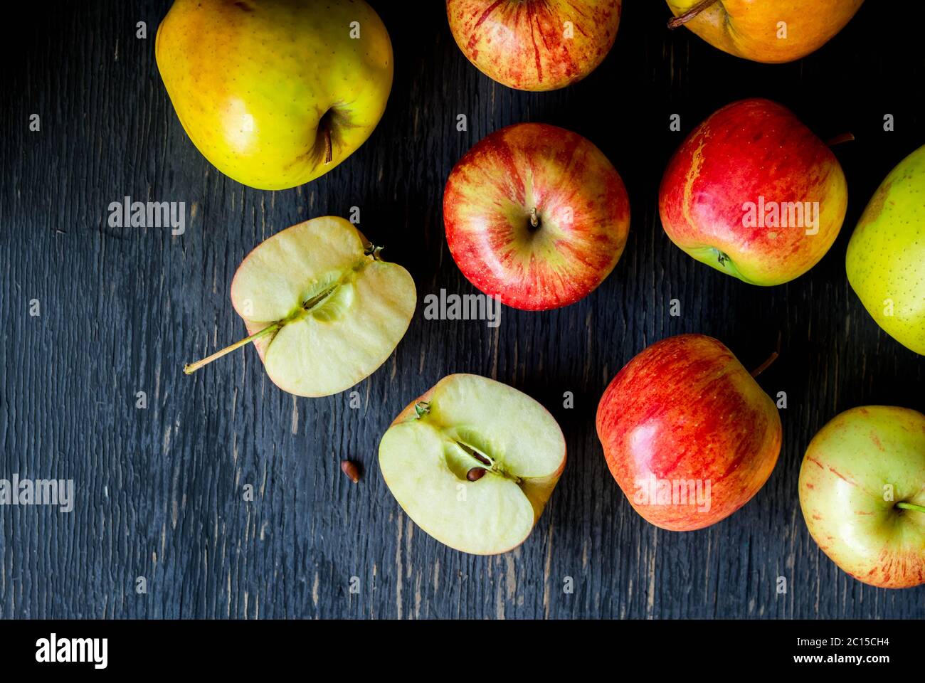 Sliced green apple with a red background hi-res stock photography and ...