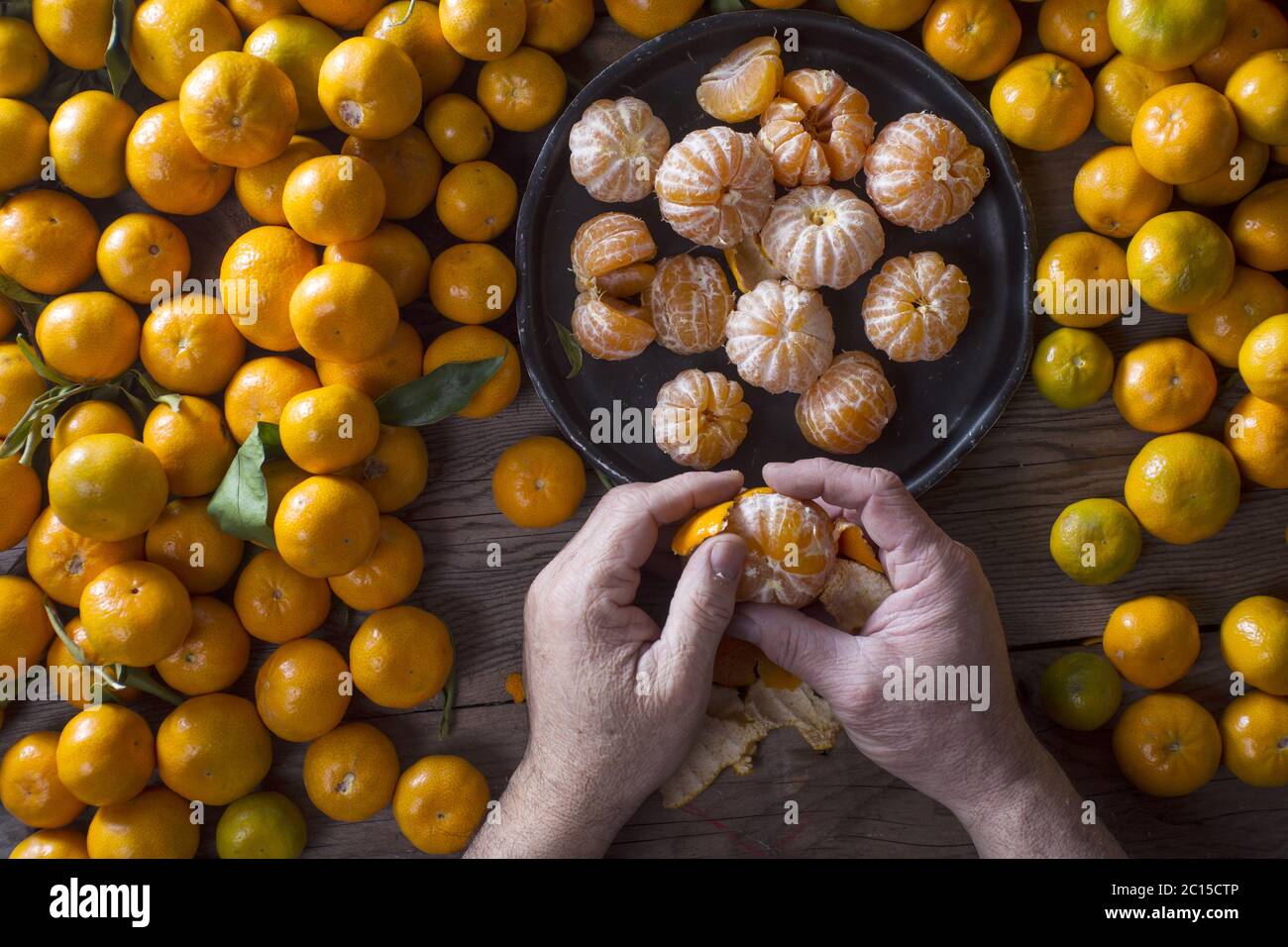 Small peeled mandarin Stock Photo - Alamy
