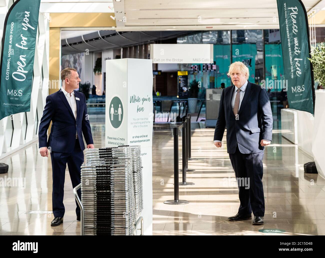 Prime Minister Boris Johnson (right) with Steve Rowe CEO of M&S during ...