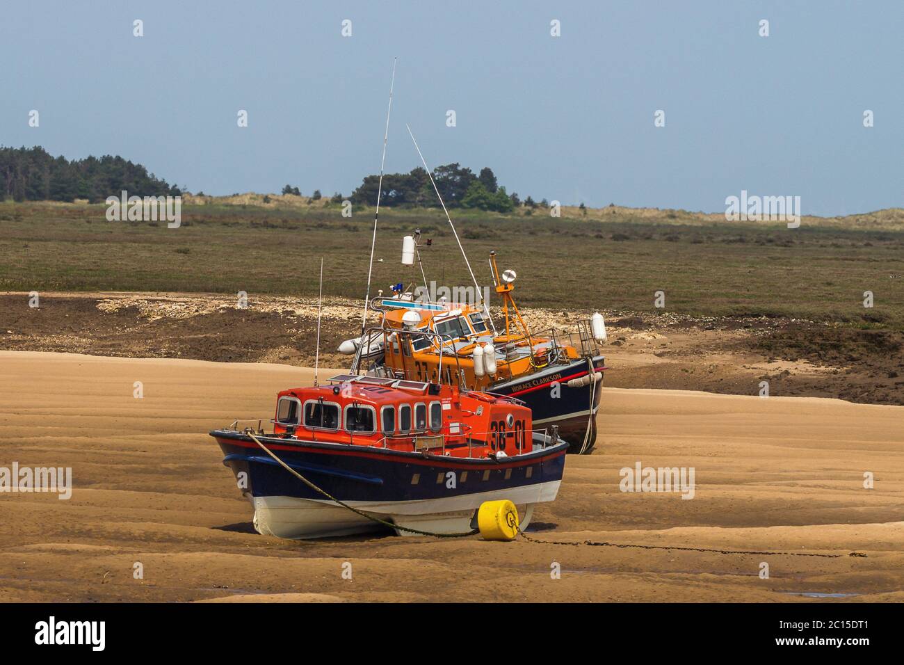 Two lifeboat sitting on the mud flaps waiting to refloat on the tide ...