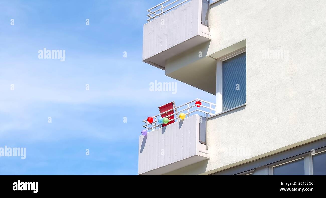 white house with a balcony decorated with colorful balloons Stock Photo ...