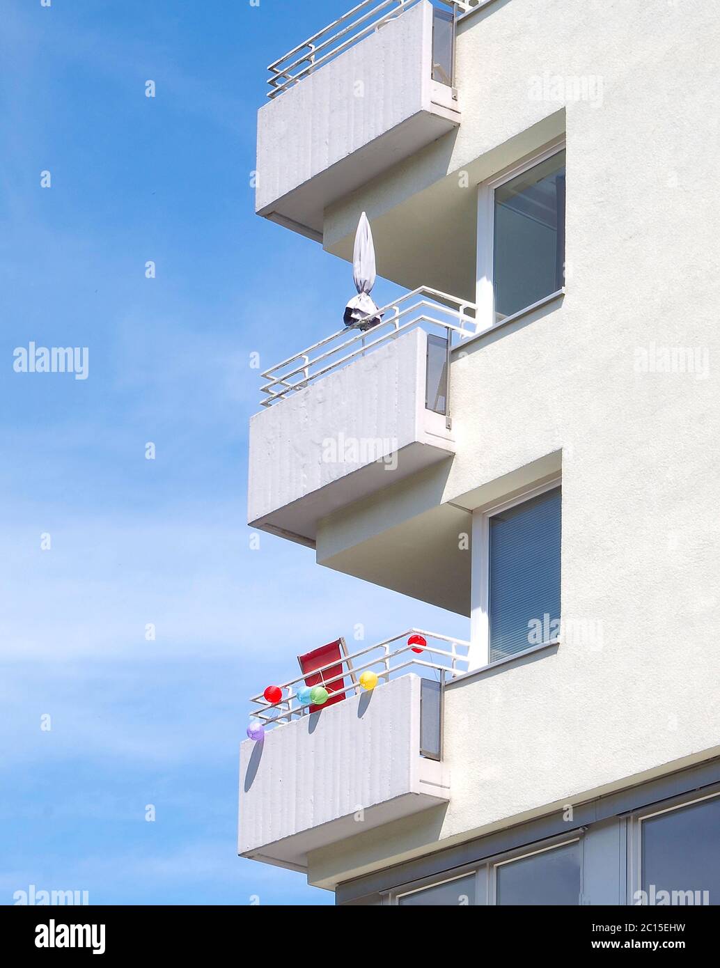 white house with a balcony decorated with colorful balloons Stock Photo ...