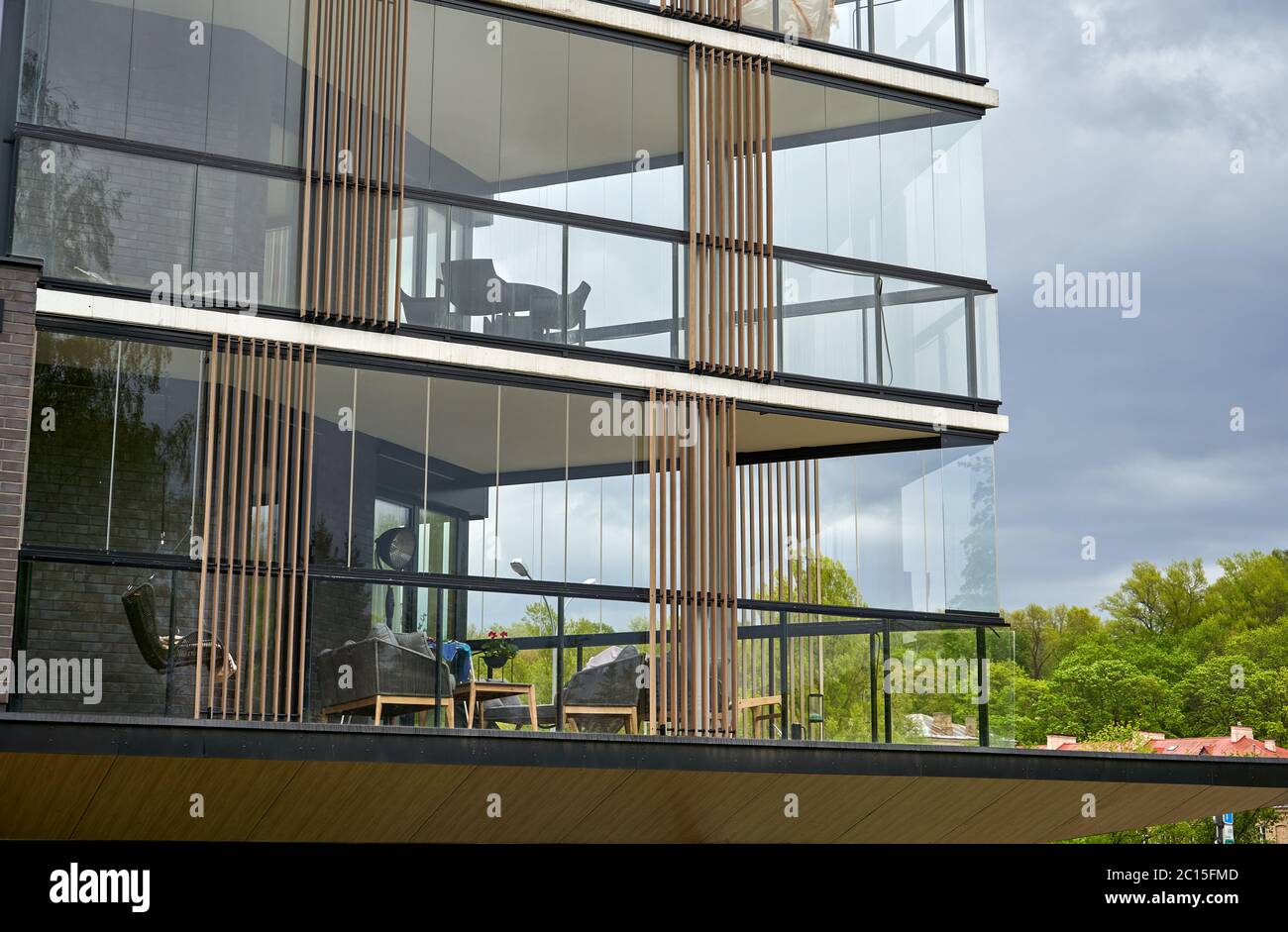 Terrace with glass in modern apartment building Stock Photo - Alamy