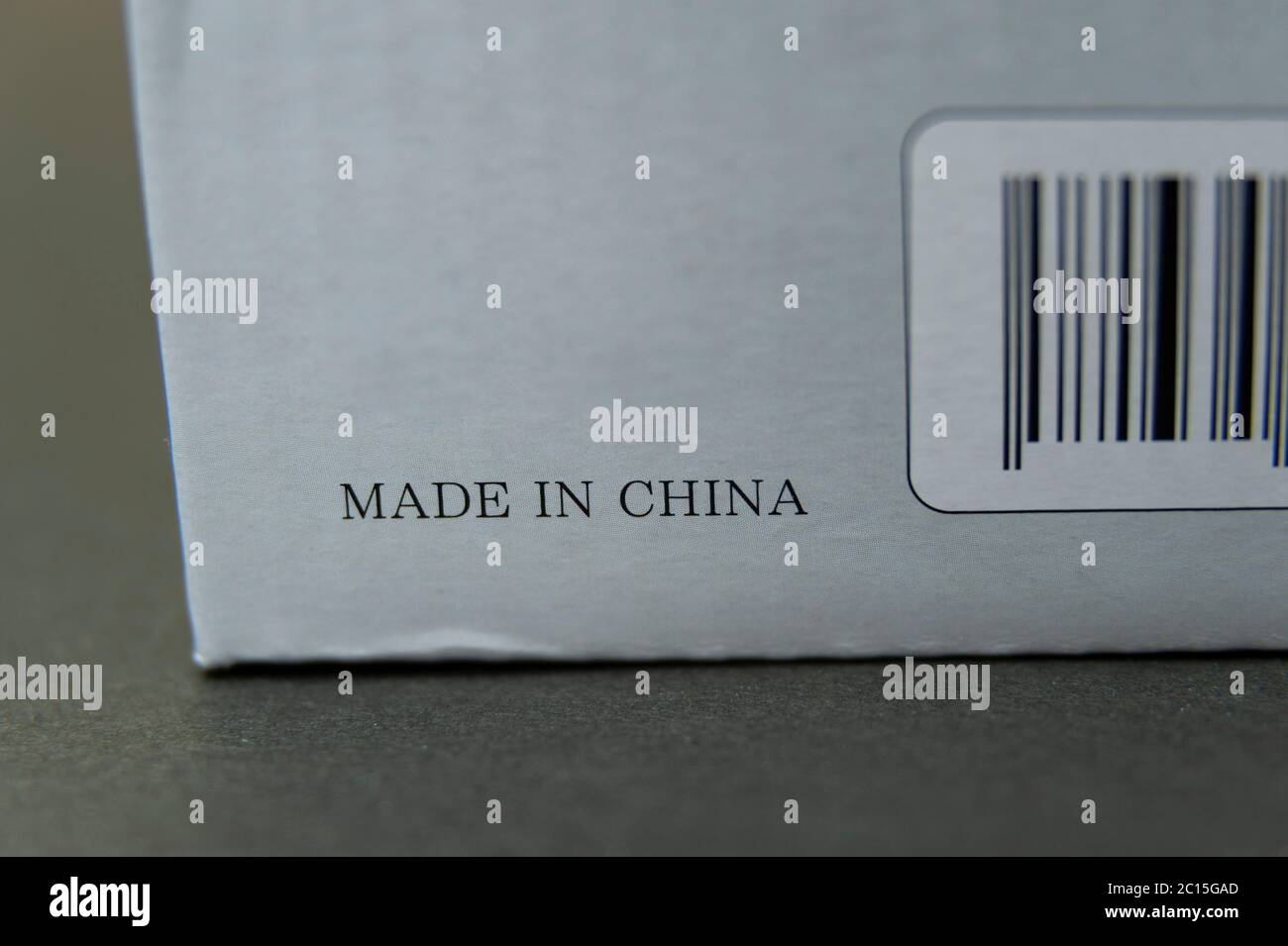 Gray cardboard box with bar code written: MADE IN CHINA. Product ...