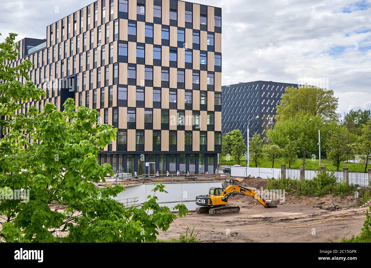 New office building near construction site Stock Photo - Alamy