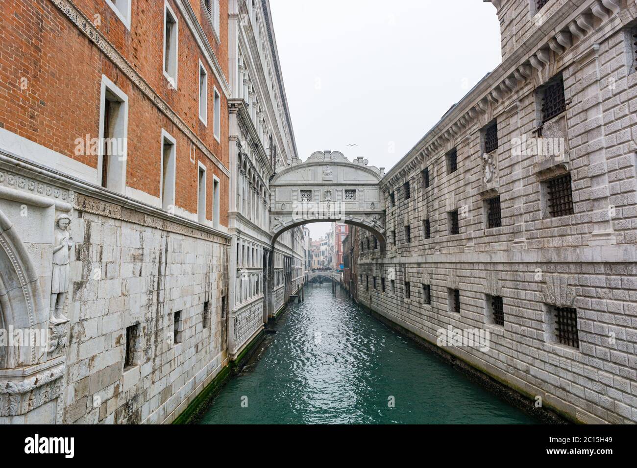 Decorative archway over a canal connecting two buildings Stock Photo ...