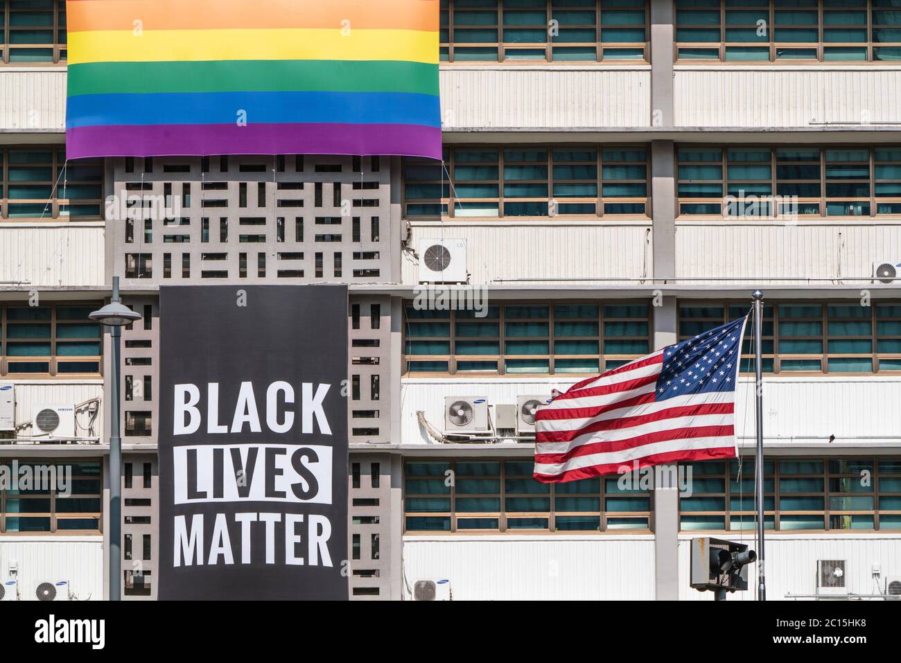 A Black Lives Matter banner, a United States national flag and a ...