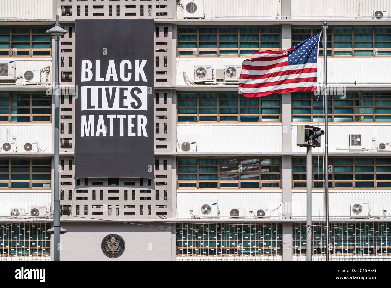 A Black Lives Matter banner, a United States national flag and a ...