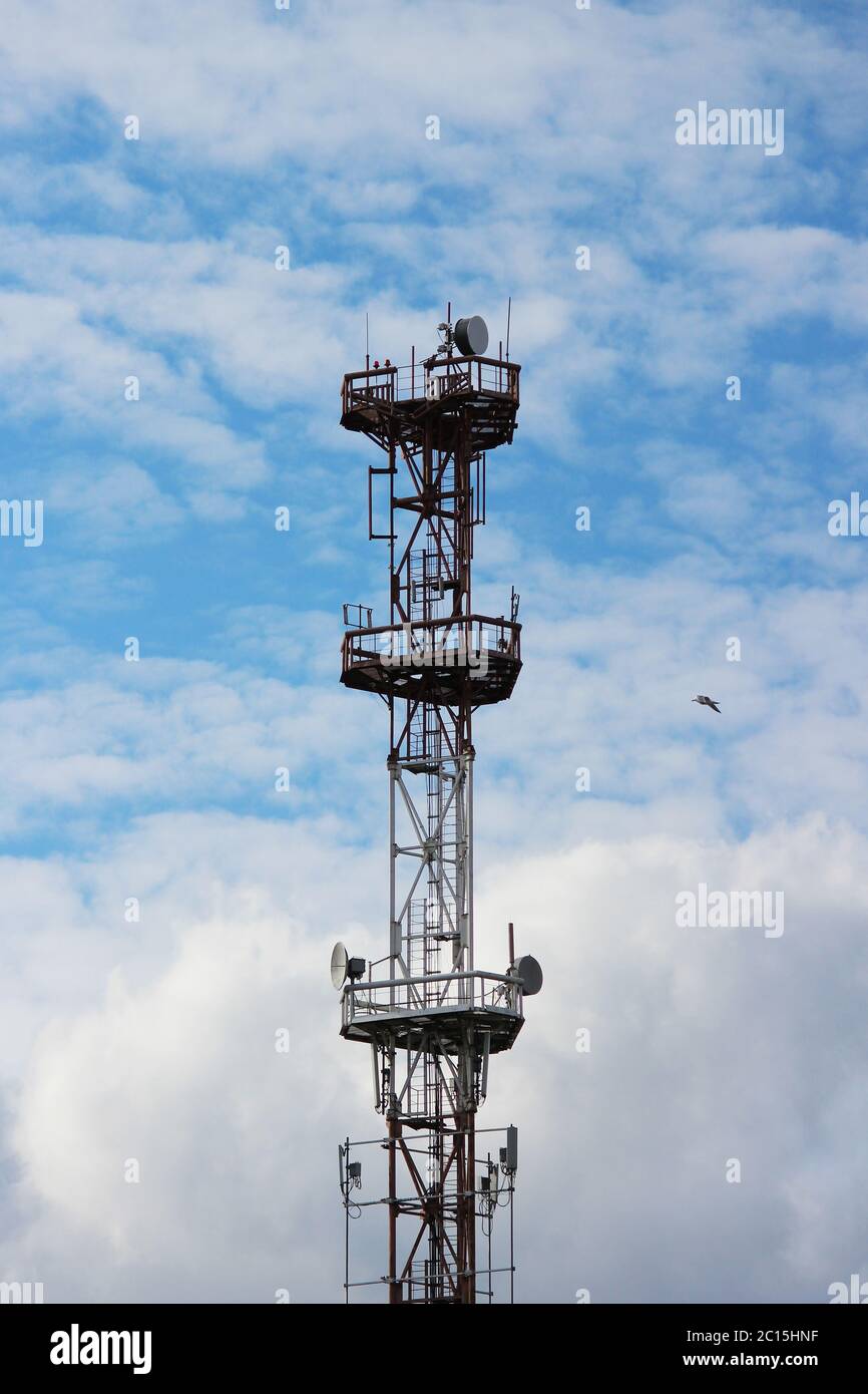 Television tower against the blue sky with clouds Stock Photo - Alamy