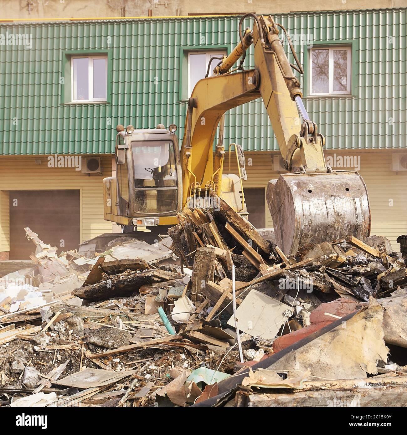 Demolition house. Building renovation at city. Industrial breaker Stock ...