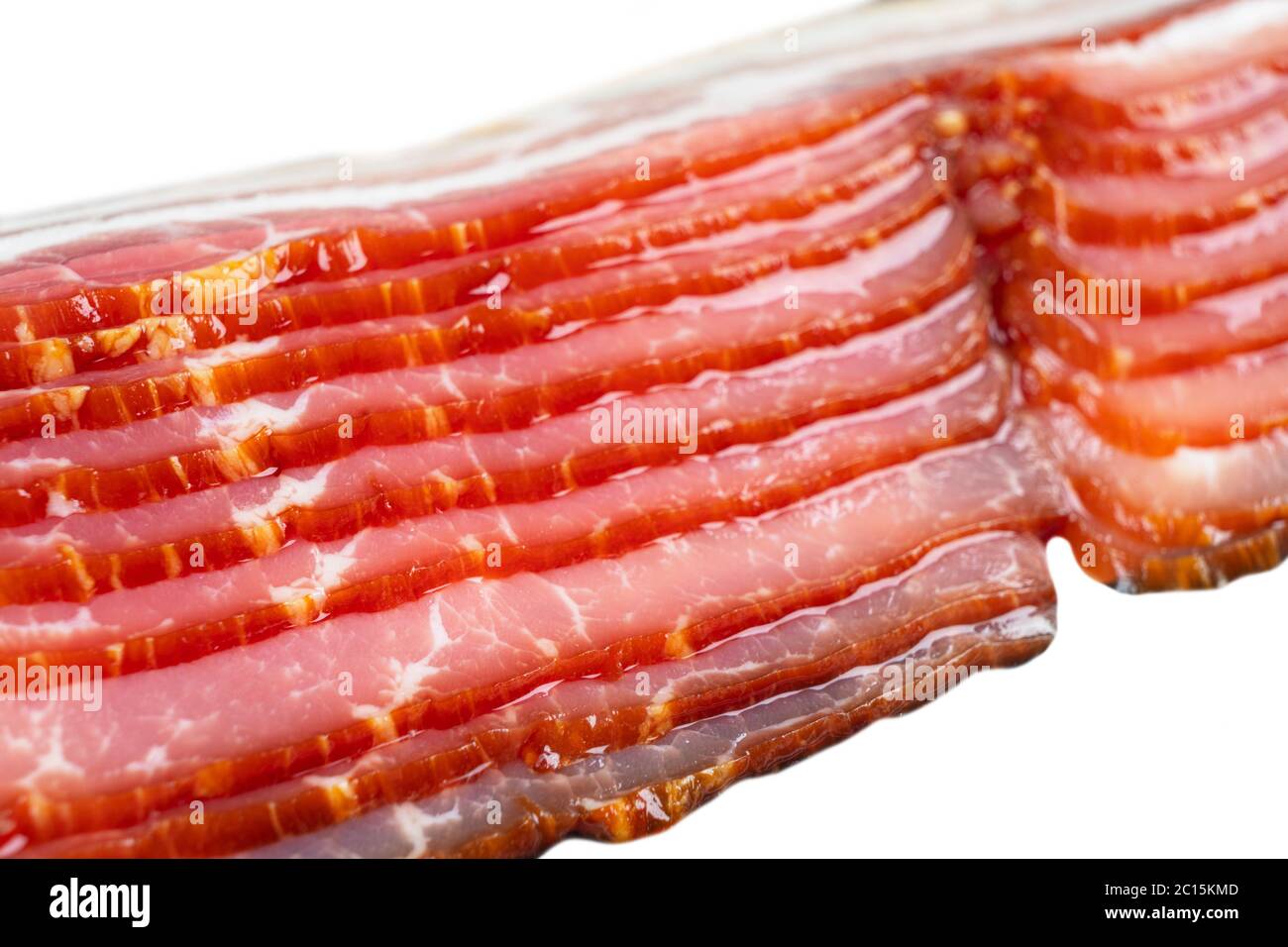 Several rows of sliced smoked bacon isolated on white background. Fresh ...