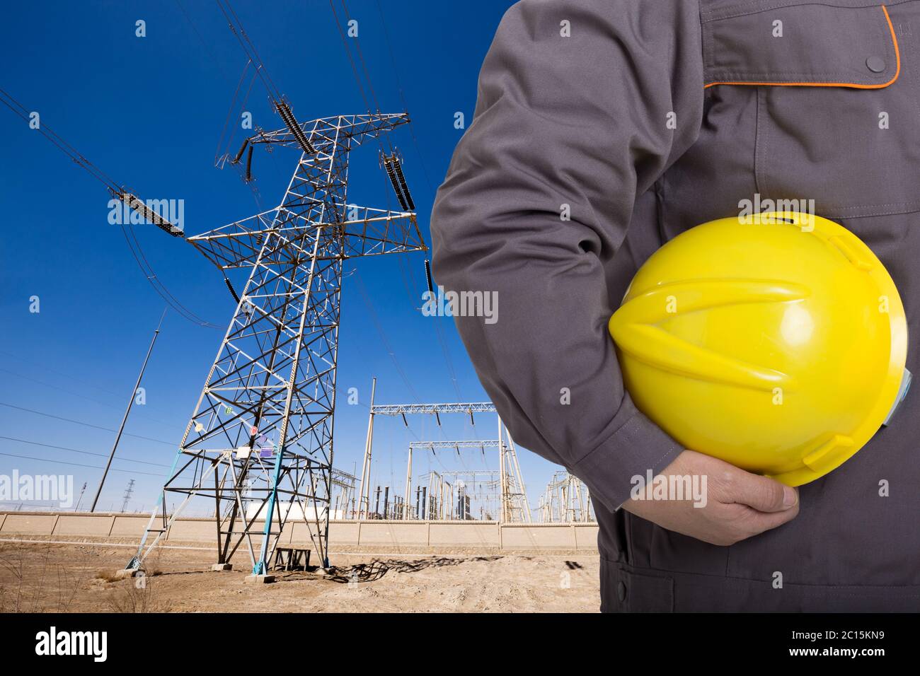 man technician with power transmission station Stock Photo - Alamy