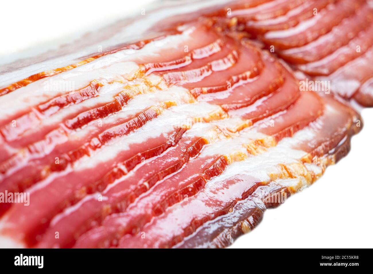 Several rows of sliced smoked bacon isolated on white background. Fresh ...