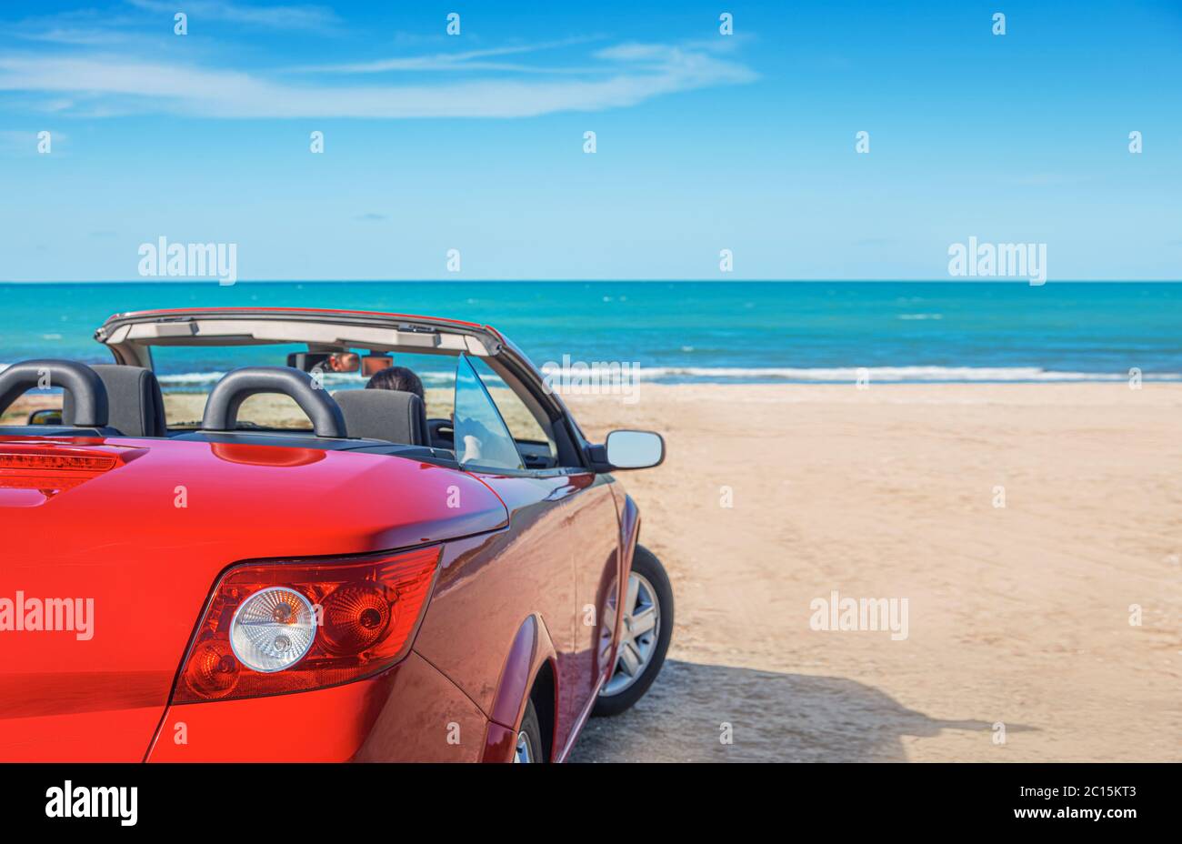 Red car on the beach Stock Photo - Alamy