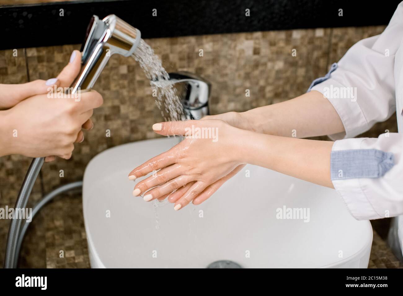 Close up of hands of female doctor cosmetologist, wearing white medical ...