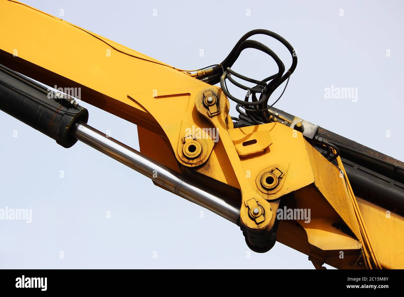 The device of a yellow loader on the railway. Hydraulic system against ...