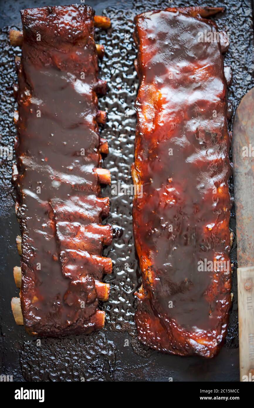 Rack of pork ribs with barbecue marinade/sauce Stock Photo - Alamy
