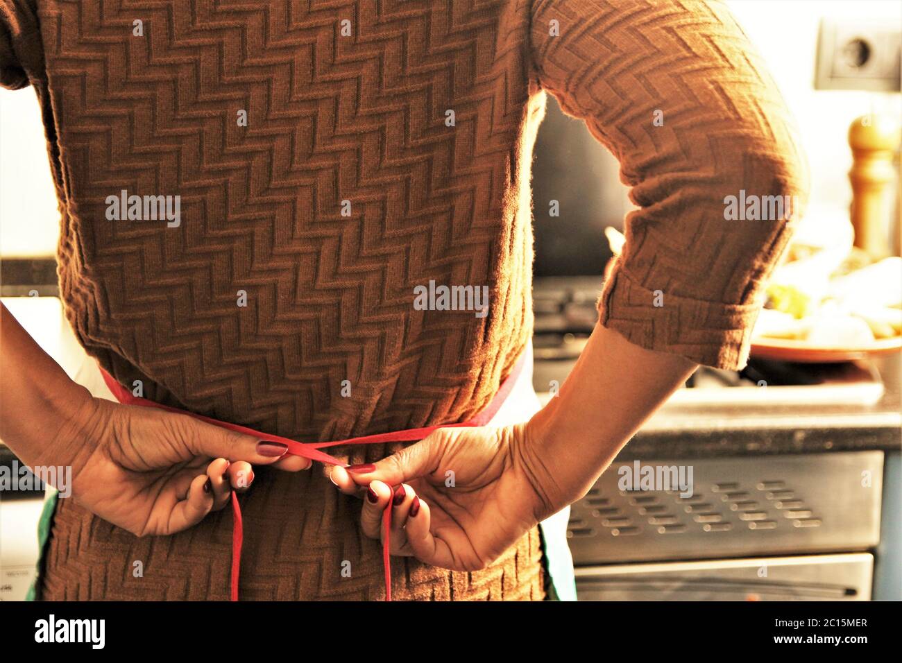 Back view woman cooking in kitchen hi-res stock photography and images ...