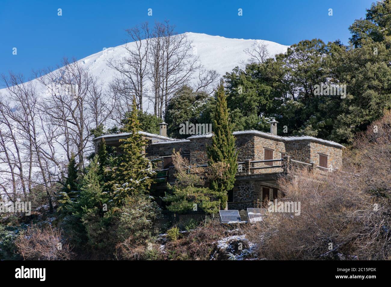 Typical stone house in the high peaks of Sierra Nevada, in the ...