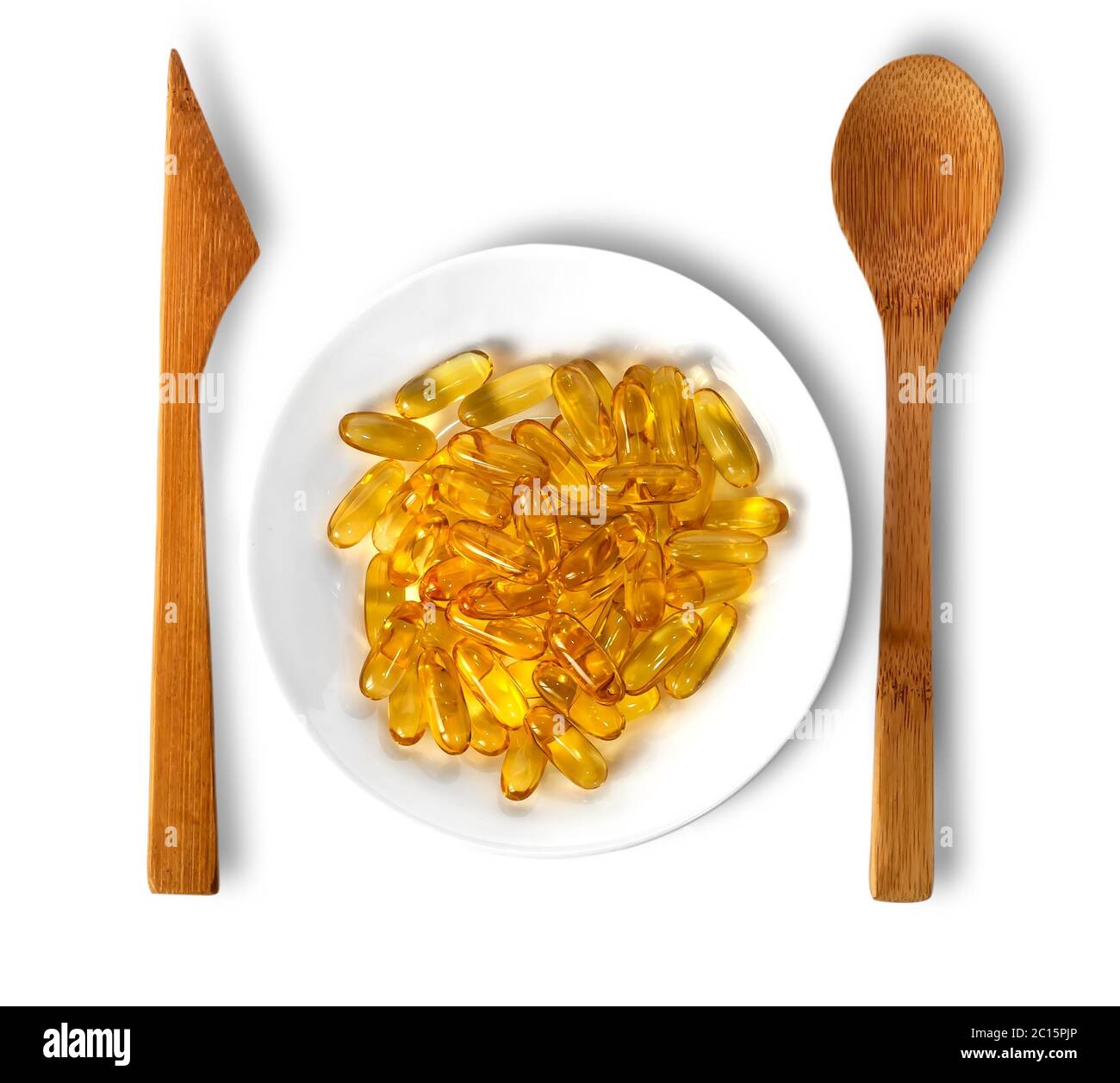 Fish oil on spoon Cut Out Stock Images & Pictures - Alamy
