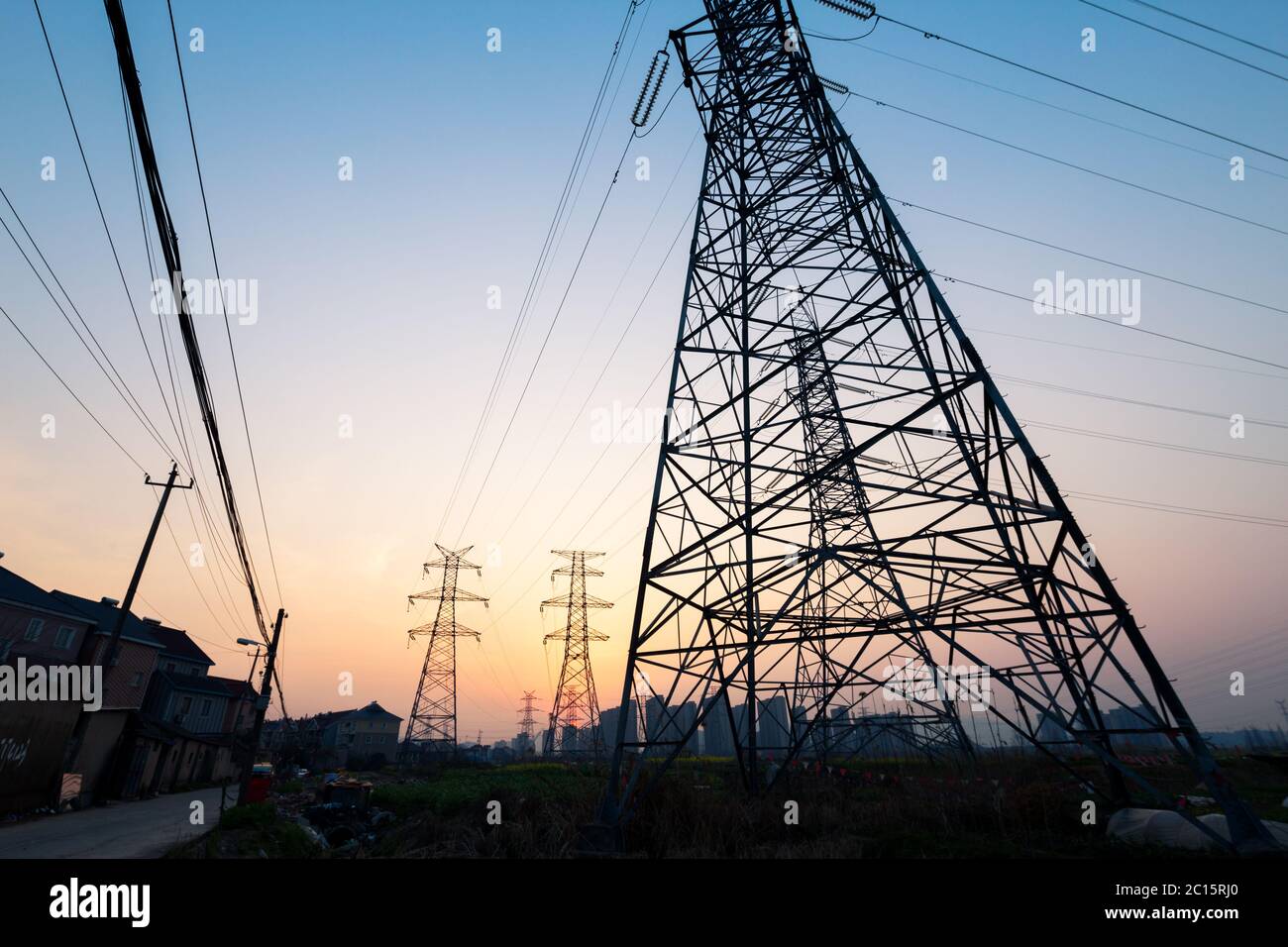 pylons in blue sky at sunrise Stock Photo - Alamy