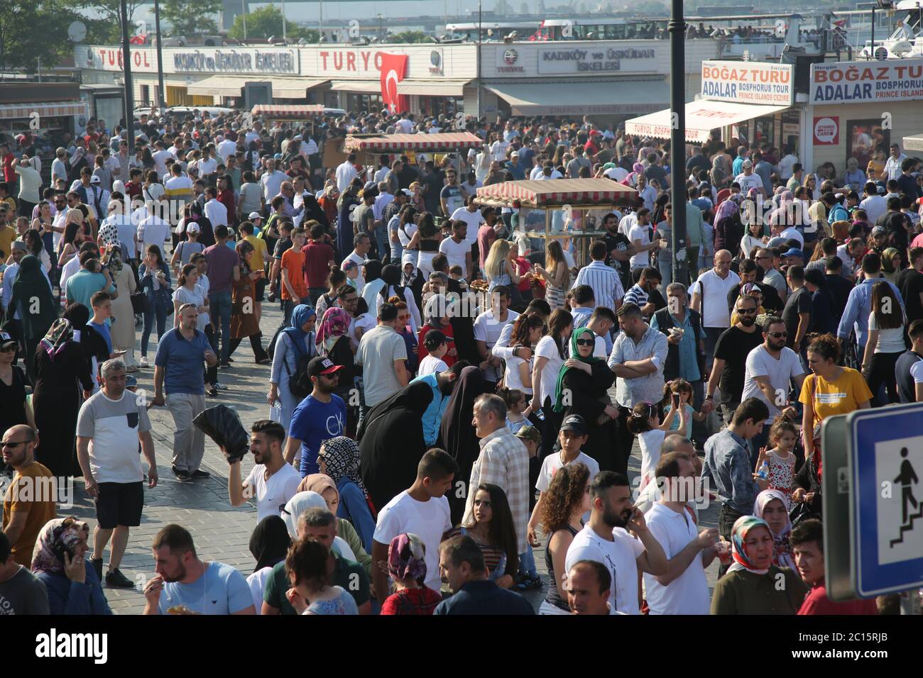 EMINONU, ISTANBUL, TURKEY; JUNE 26, 2018. People crowd walking through ...