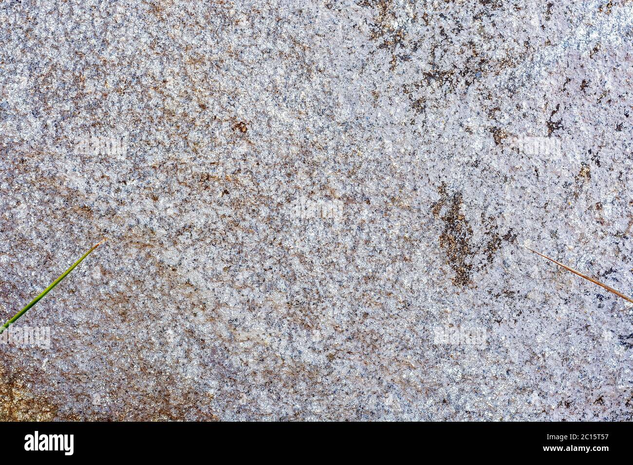 Rough rough surface of gray stone with reddish spots. For use as an ...