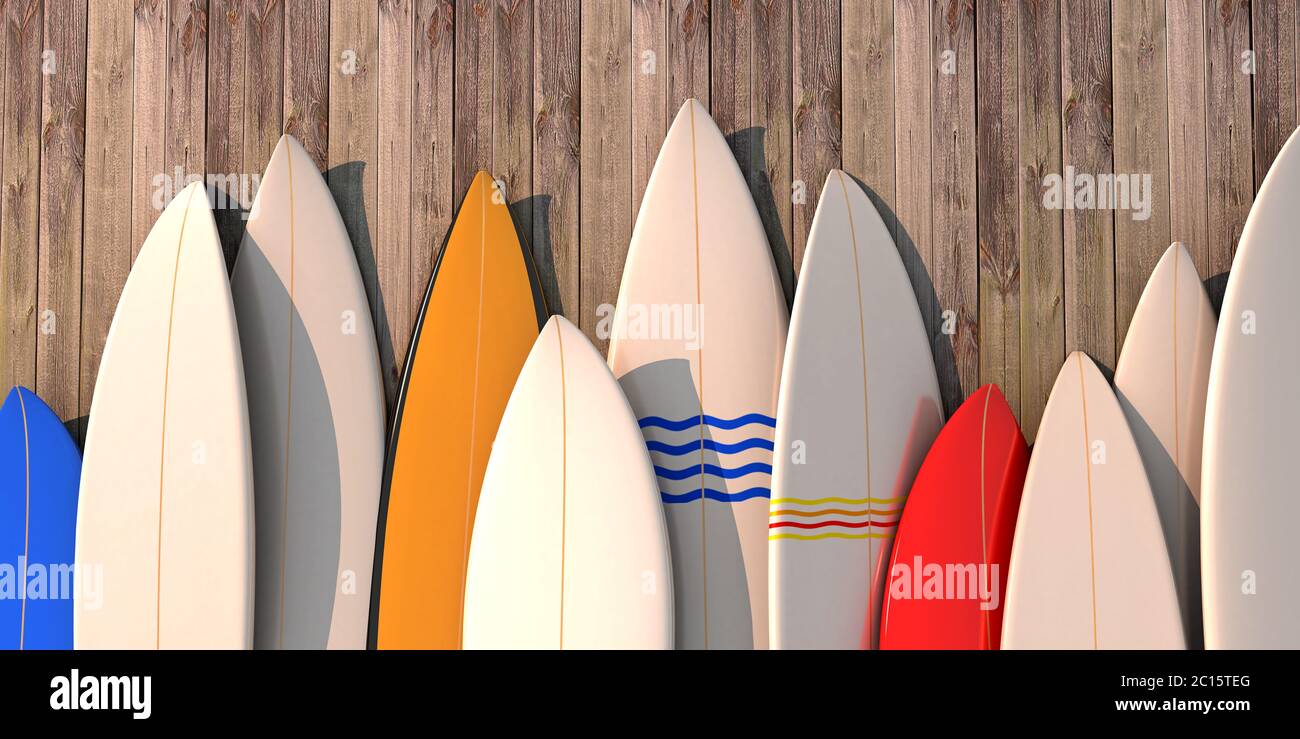 Many different colored surfboards standing in a row on a wooden wall ...