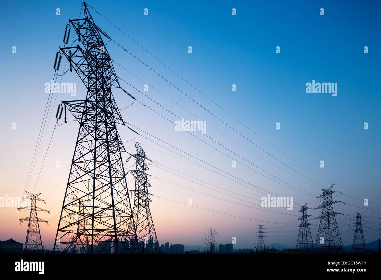 pylons in blue sky at sunrise Stock Photo - Alamy