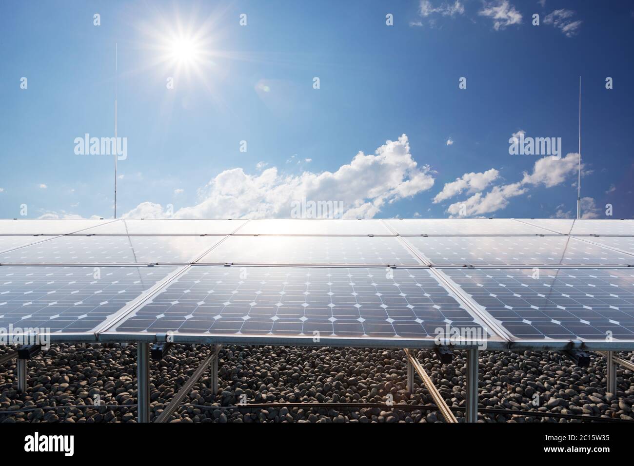 solar panels with blue sunny sky Stock Photo - Alamy