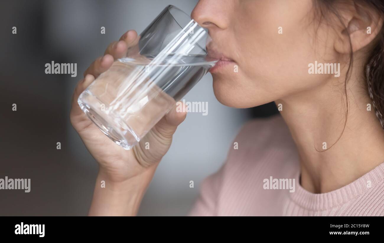 Close up profile thirsty woman drinking pure mineral water Stock Photo ...