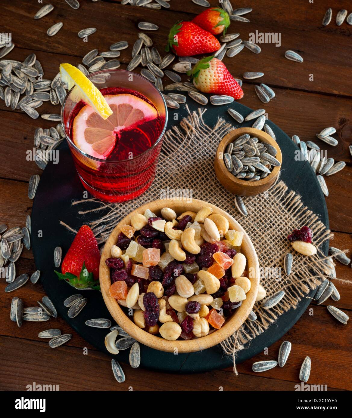 cocktail of red bitter and lemon with dried fruit and dehydrated snack ...