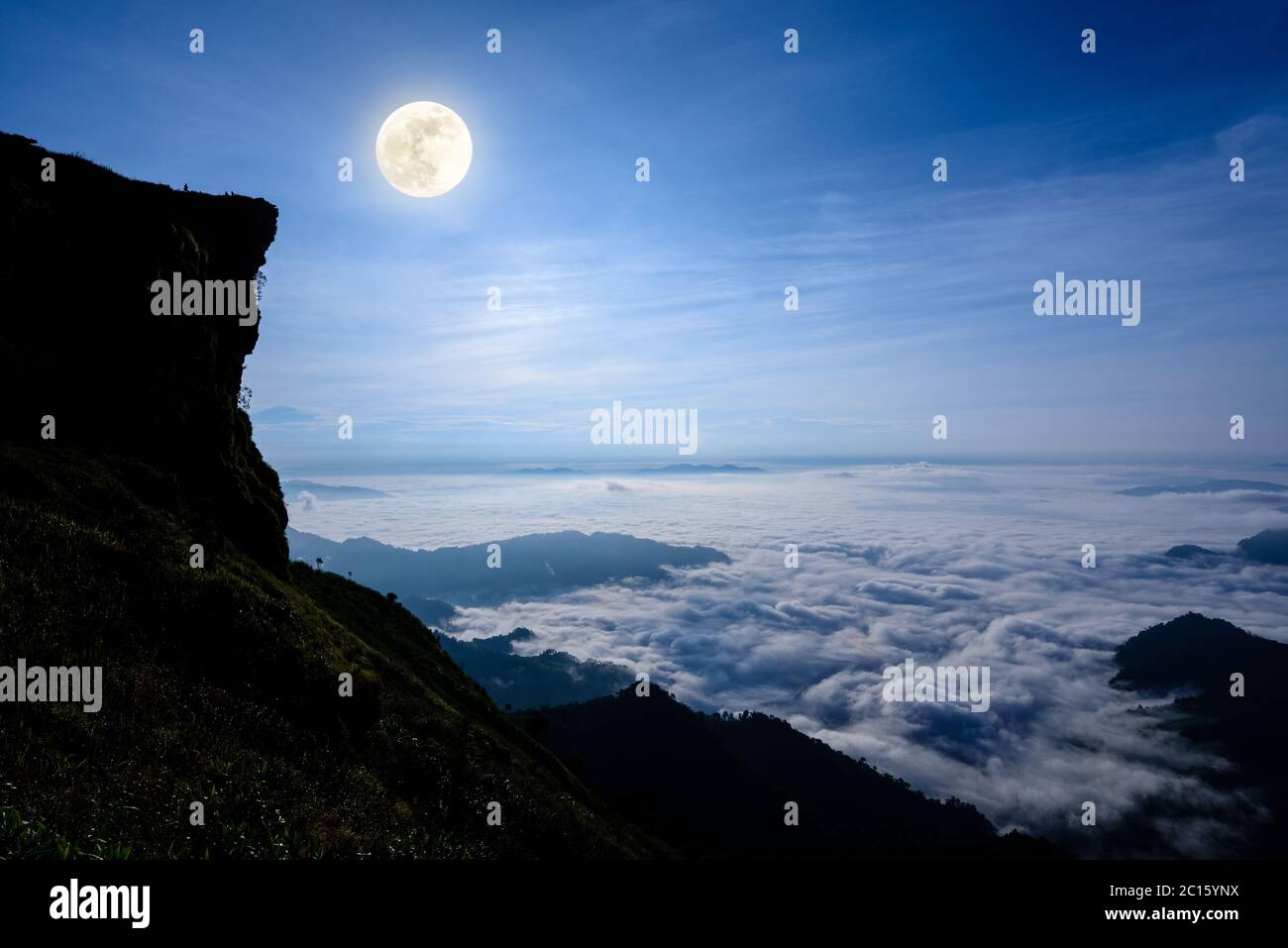 Full moon on the peak mountain Stock Photo - Alamy