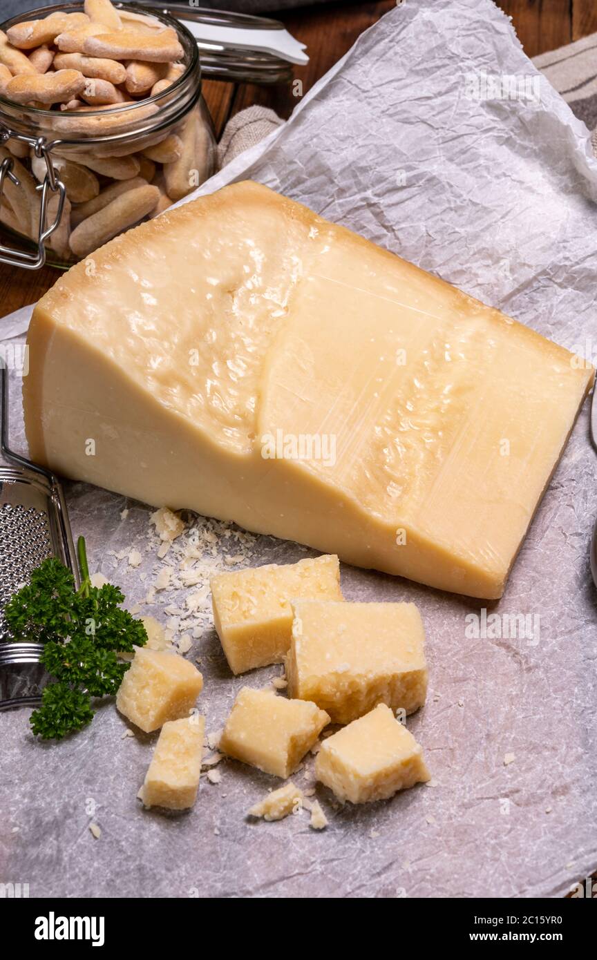 Big wedge of parmigiano-reggiano parmesan hard Italian cheese made from ...