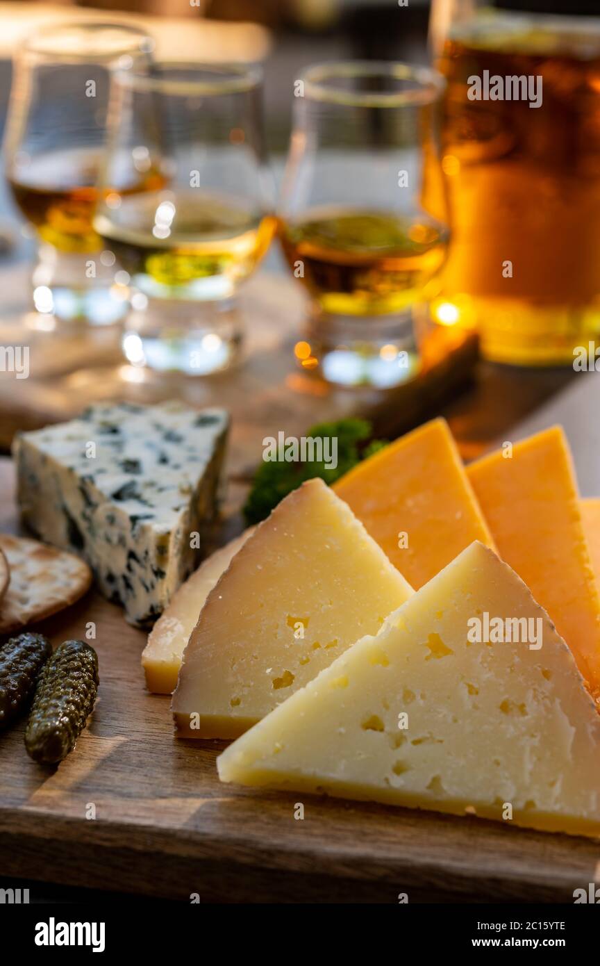 Whiskey and cheese pairing, tasting whisky glasses and plate with ...