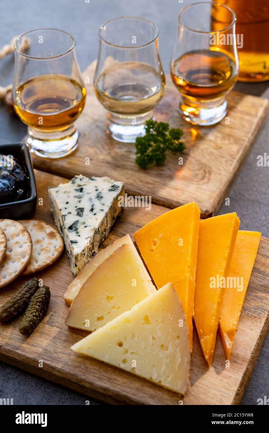 Whiskey and cheese pairing, tasting whisky glasses and plate with ...