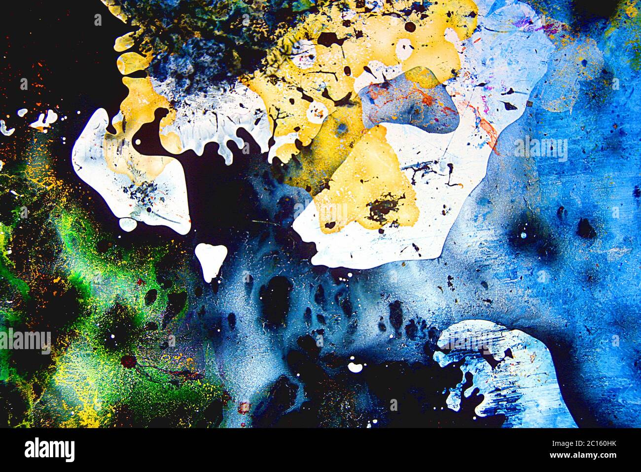 Colored liquids mixed together in fluid creating colorful abstract ...