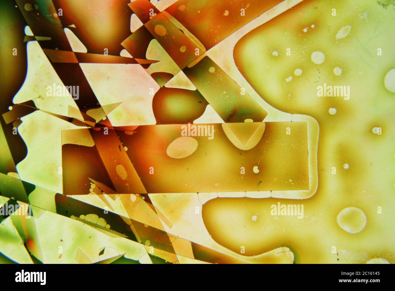 Colored liquids mixed together in fluid creating colorful abstract ...