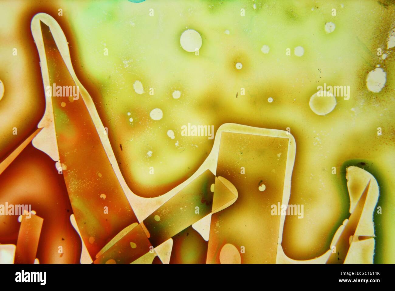 Colored liquids mixed together in fluid creating colorful abstract ...
